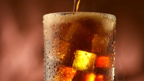 Coke with ice cubes background | Stock Video | Pond5