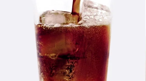 Coke Poured Over Ice Cubes In Glass | Stock Video | Pond5