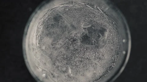 Cold mineral water with ice cube closeup... | Stock Video | Pond5
