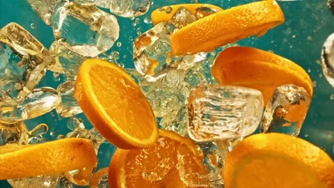 Cold orange slices, ice cube and liquid,... | Stock Video | Pond5
