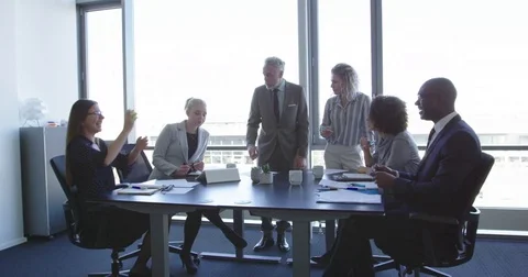 Colleagues having fun during a meeting a... | Stock Video | Pond5