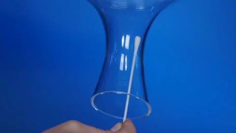 Collect swab sample from glass vase that... | Stock Video | Pond5