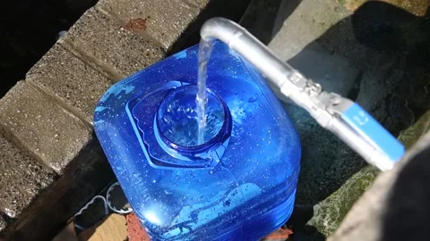 Collecting natural spring water in Afric... | Stock Video | Pond5