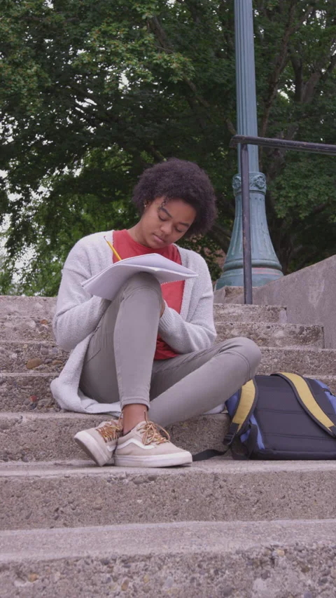 College Student Sit On Steps On Campus | Stock Video | Pond5