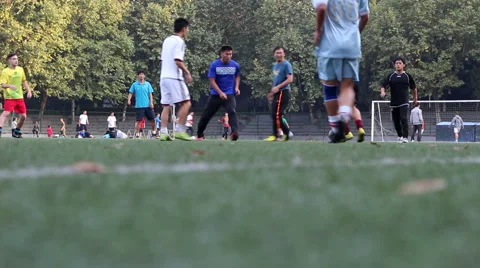 college students playing football on pla... | Stock Video | Pond5