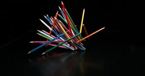 Color crayons falling against Black Back... | Stock Video | Pond5