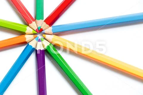 Color pencil arrange in ray shape on white paper background ~ Premium ...