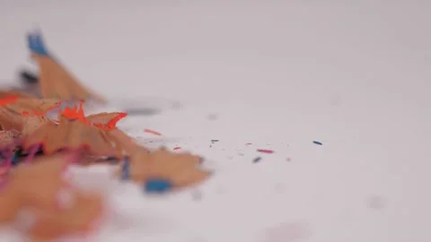 color pencil shavings falling on white b... | Stock Video | Pond5