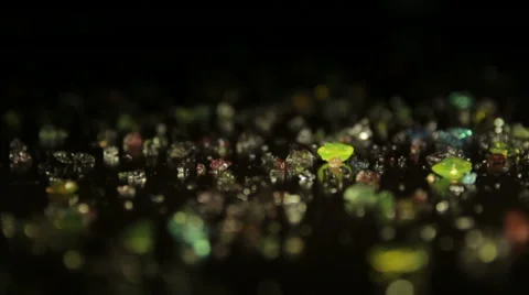 Colored crystals scattered on a table. A... | Stock Video | Pond5