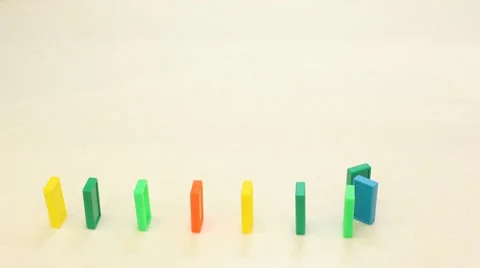 Colored dominos lines up on the table an... | Stock Video | Pond5