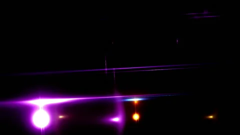 Colored lens flare light ray with dust p... | Stock Video | Pond5