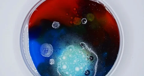 Colorful chemical reaction dissolving of... | Stock Video | Pond5