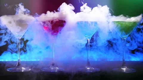 Colorful cocktails with dry ice smoke ef... | Stock Video | Pond5