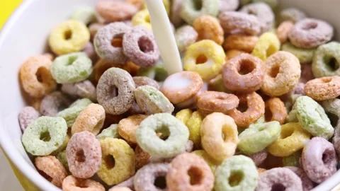 Colorful corn rings with milk for breakf... | Stock Video | Pond5