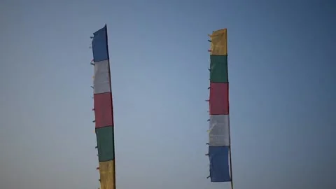 Colorful flags blowing in the wind. With... | Stock Video | Pond5
