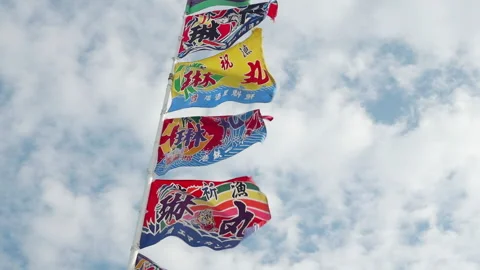 Colorful flags flying in the sky in slow... | Stock Video | Pond5