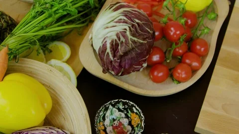 Colorful shot of a kitchen table full of... | Stock Video | Pond5