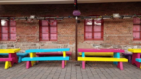 Colorful tables and benches in front of ... | Stock Video | Pond5