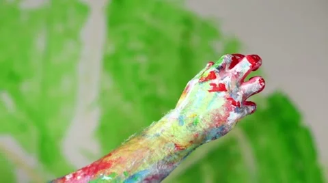 Coloured hand moves, rotates and clenche... | Stock Video | Pond5