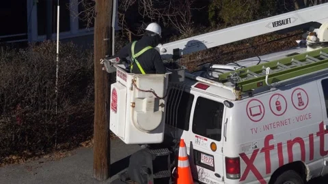 Comcast Xfinity cable man descends telep... | Stock Video | Pond5