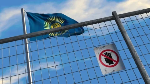 Commonwealth flag behind barrier fence | Stock Video | Pond5