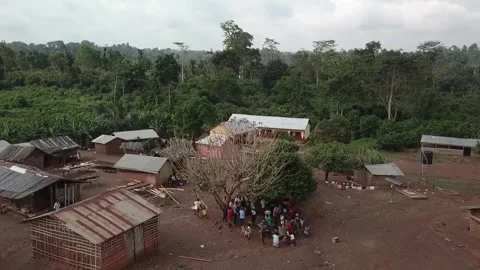 Community meeting under a tree in a remo... | Stock Video | Pond5