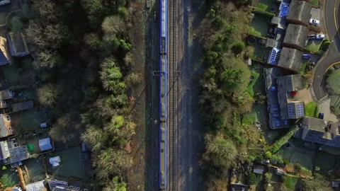Commuter Train Passing Through a Town Bi... | Stock Video | Pond5