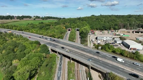 Commuter Train Speeding Under a Motorway... | Stock Video | Pond5