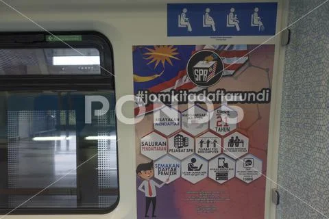 Commuters on Mass Rapid Transit (MRT) train. Stock Image #128472271