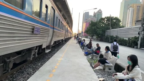 Commuters waiting for local train rush h... | Stock Video | Pond5