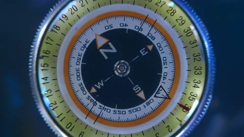 Compass with a rotating arrow on the bla... | Stock Video | Pond5