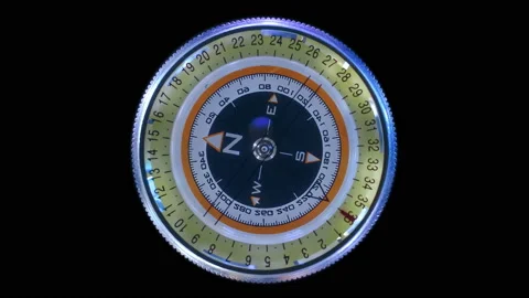 Compass with a rotating arrow on the bla... | Stock Video | Pond5