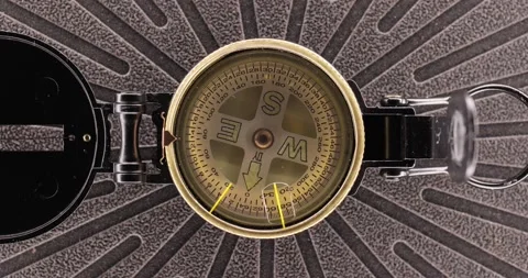 Compass spinning around on boat table | Stock Video | Pond5