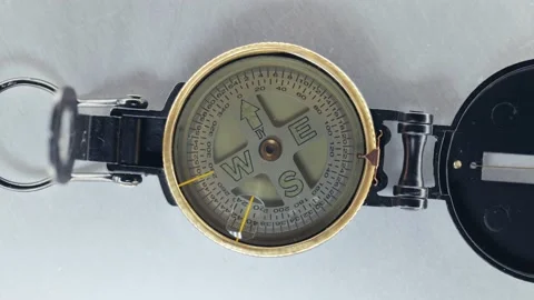 Compass spinning around on boat table | Stock Video | Pond5