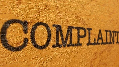 Complaint text on grunge background | Stock Video | Pond5