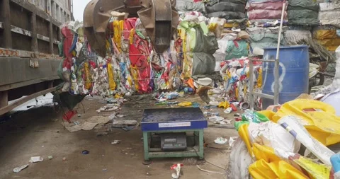 compressed cube of waste plastics being ... | Stock Video | Pond5