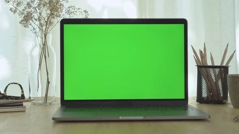 A computer laptop with green screen on t... | Stock Video | Pond5