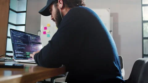Computer programmer working on a code in... | Stock Video | Pond5