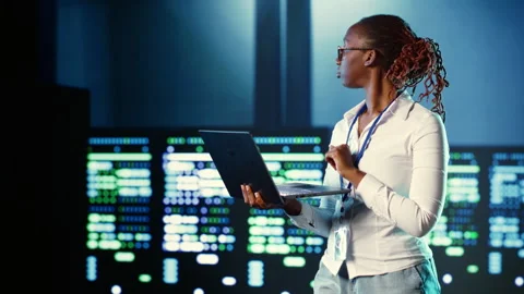 Computer scientist coding in data center | Stock Video | Pond5