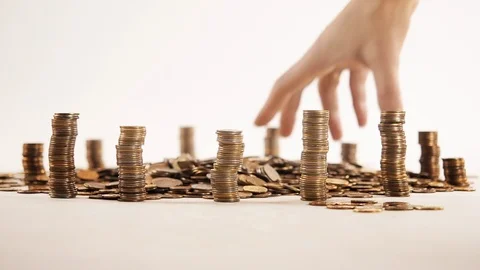 The concept of money. Columns of gold co... | Stock Video | Pond5