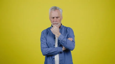 Concerned elderly man thinks touching gr... | Stock Video | Pond5