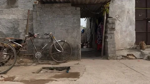 Concrete house in the slum, Passenger ca... | Stock Video | Pond5