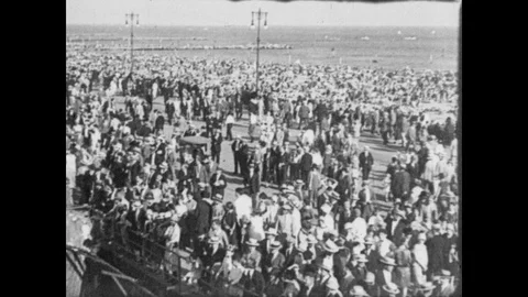 CONEY ISLAND 1920s: Crowd at fair. Man w... | Stock Video | Pond5