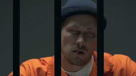 Confident bandit chewing toothpick behin... | Stock Video | Pond5