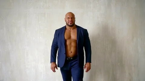 confident bodybuilder dressed in luxury ... | Stock Video | Pond5