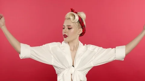 Confident pin up woman showing biceps on... | Stock Video | Pond5