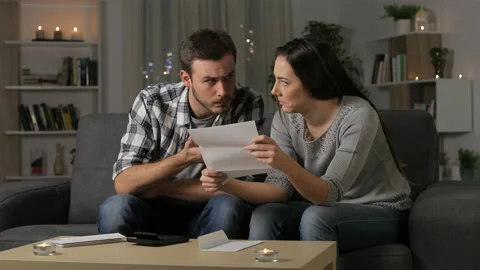 Confused couple reading a letter in the ... | Stock Video | Pond5