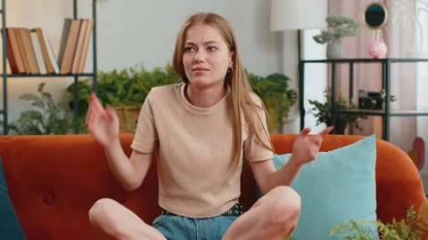 Confused young woman feeling embarrassed... | Stock Video | Pond5