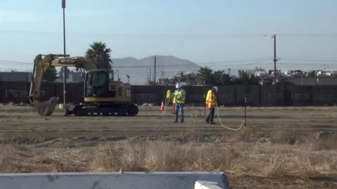 Construction crew working on ground, bul... | Stock Video | Pond5