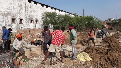 Construction Labour Team Digging a pile ... | Stock Video | Pond5
